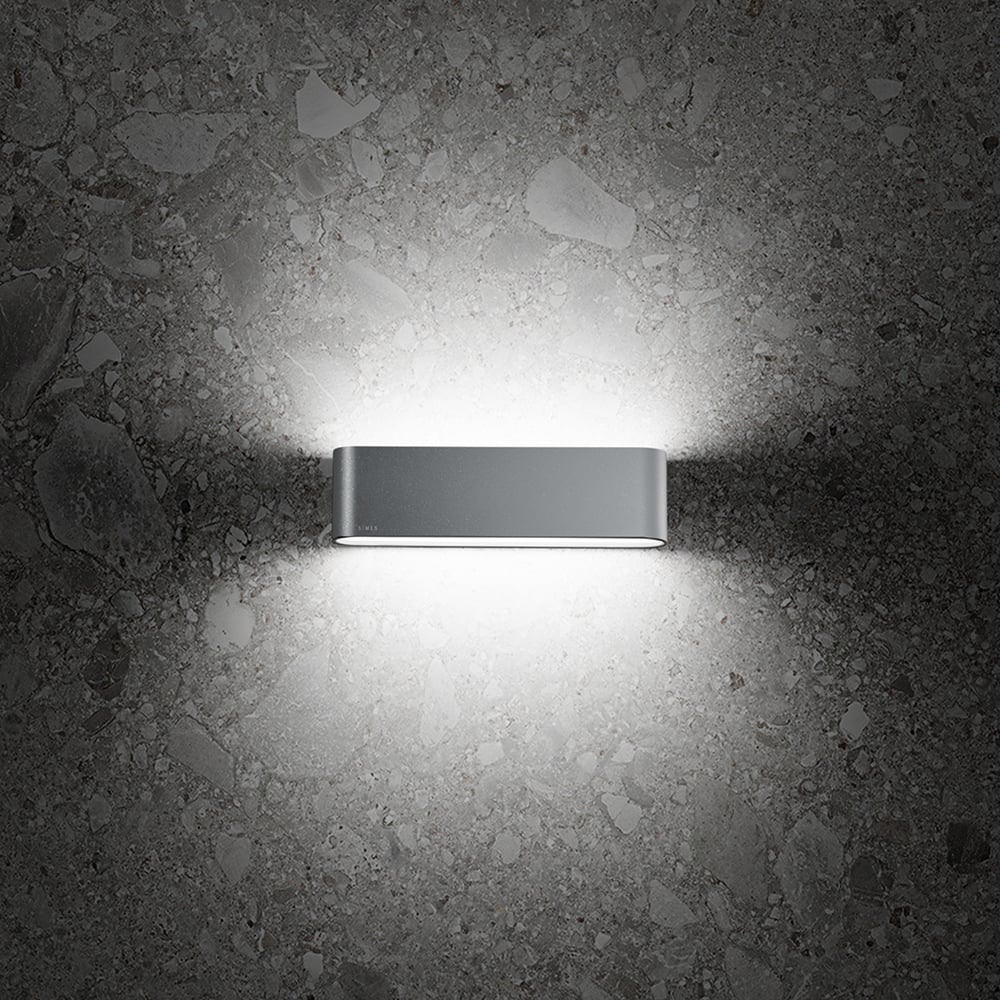 Pocket, outdoor wall mounted luminaire